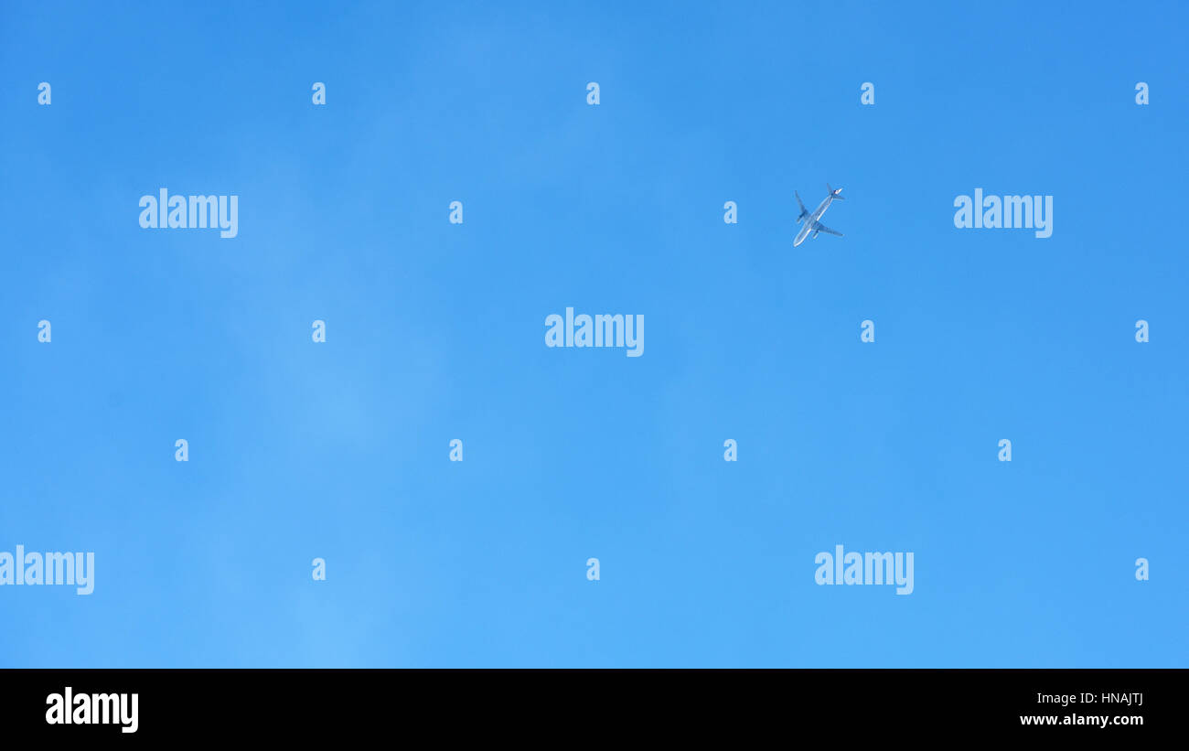 White airplane and blue sky. Upward,looking up Stock Photo - Alamy