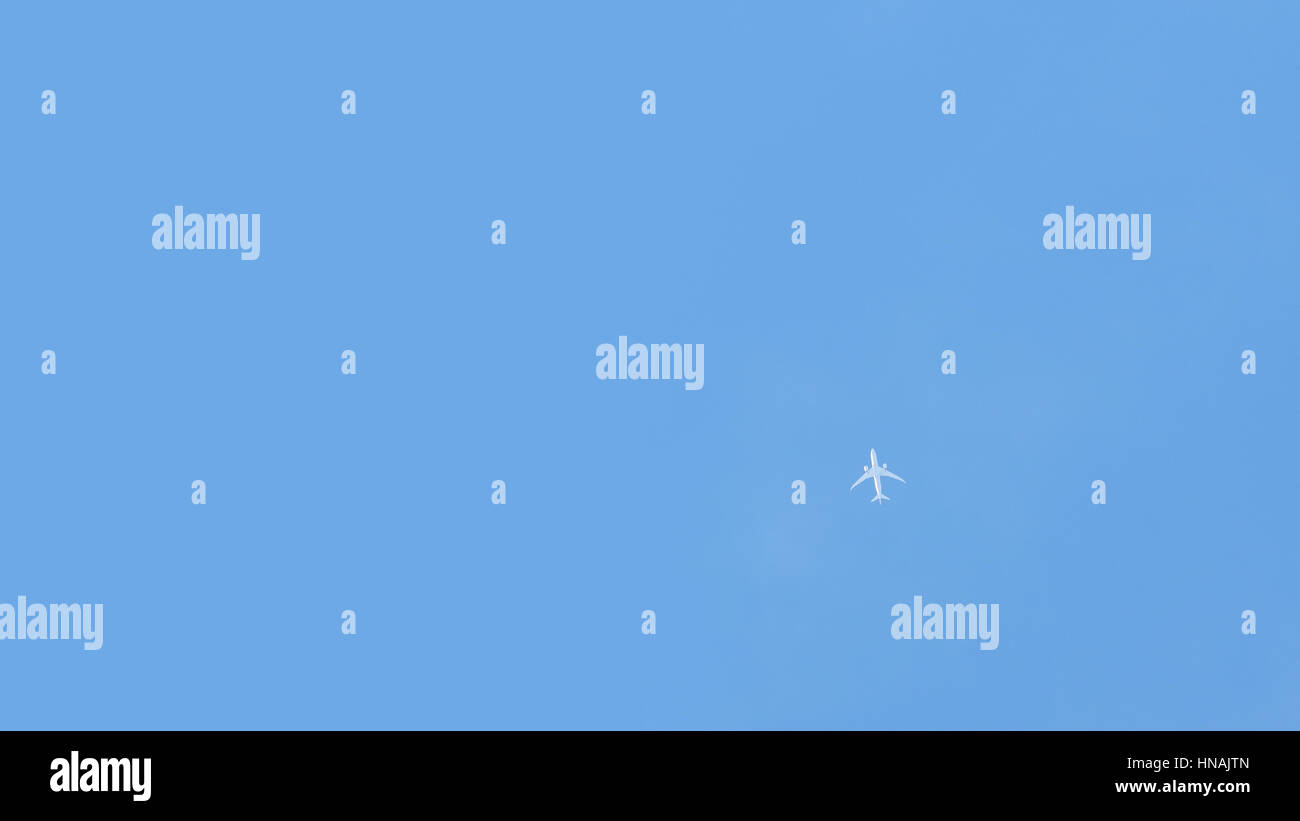 White airplane and blue sky. Upward,looking up Stock Photo - Alamy