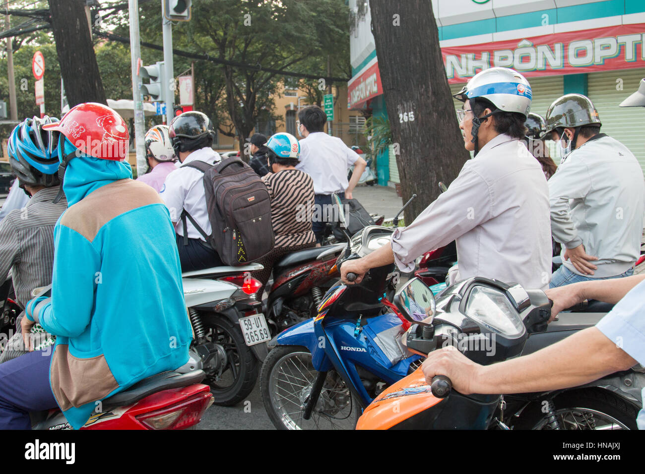 Vietnamese riding scooters hi-res stock photography and images - Alamy