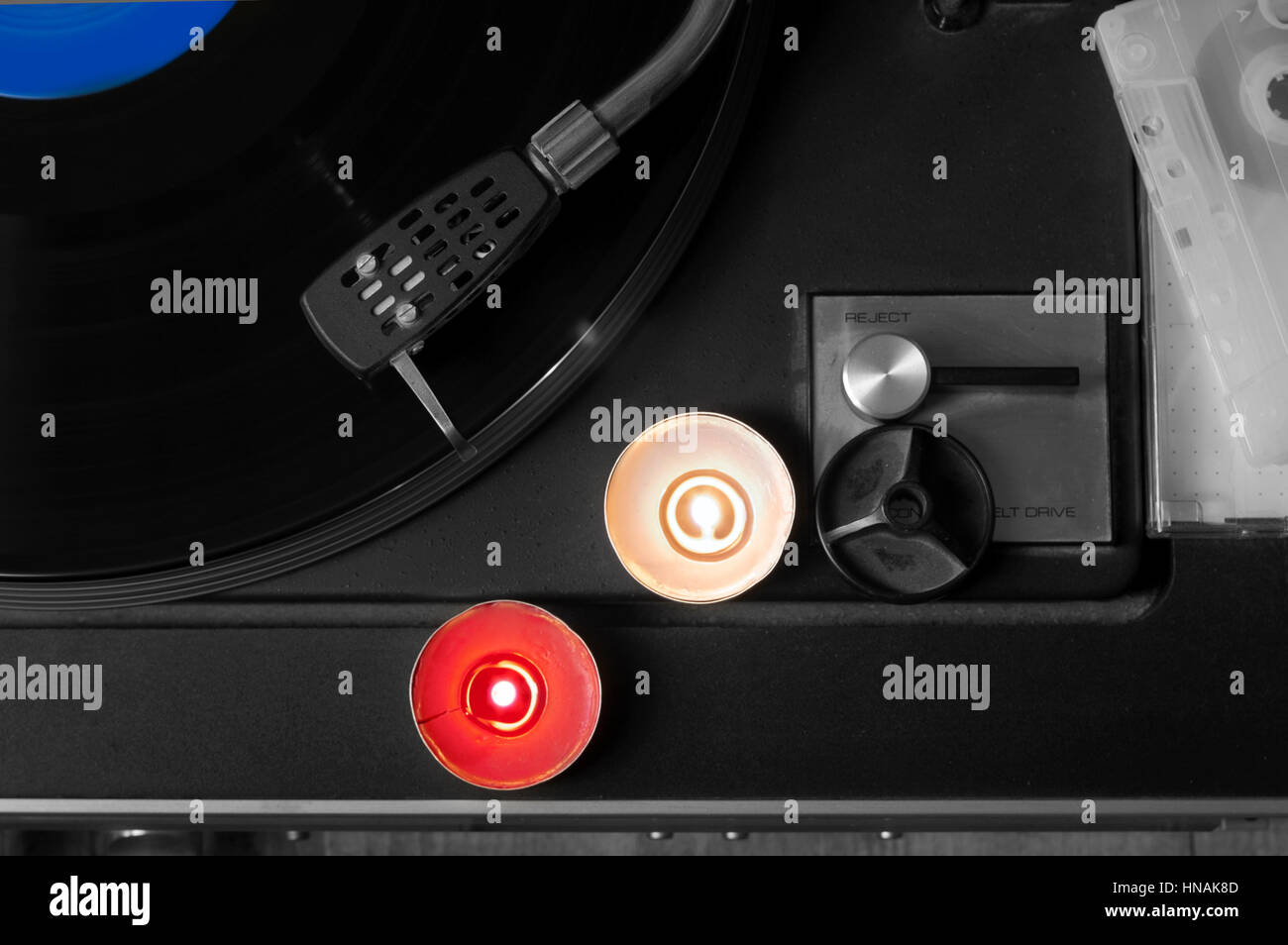 Vinyl turntable and candles on the top of it, concept of music and ...