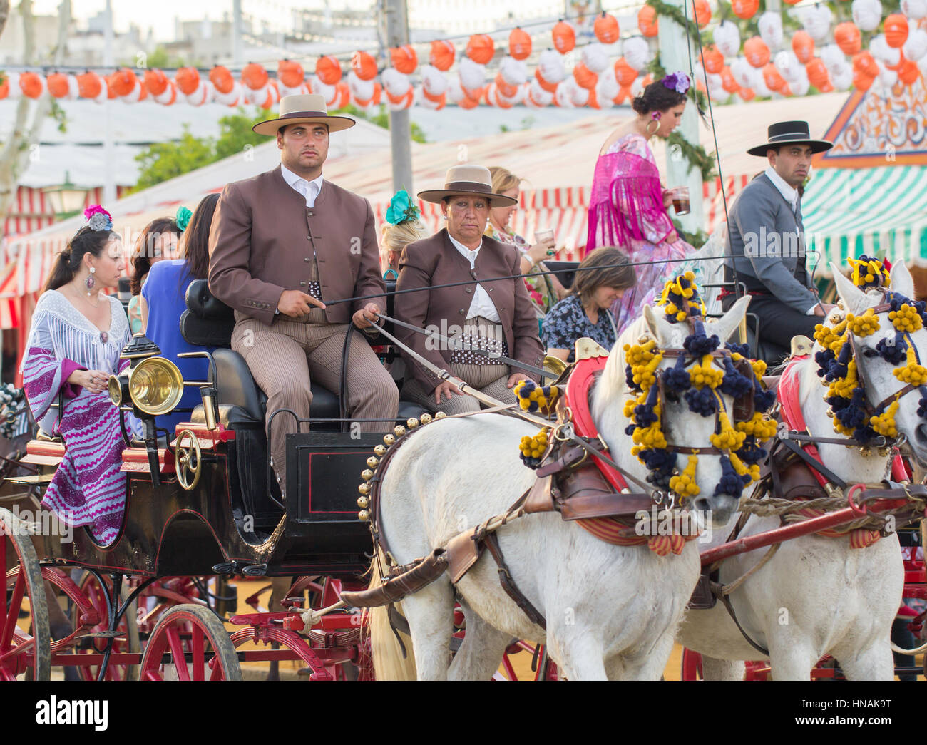 SEVILLE, SPAIN - APR, 25: people dressed in traditional costumes riding ...
