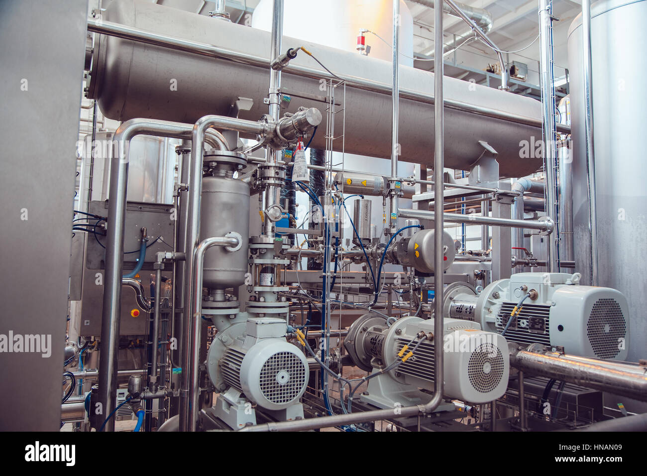 Modern beer plant, with brewing kettles, vessels, tubs and pipes made ...