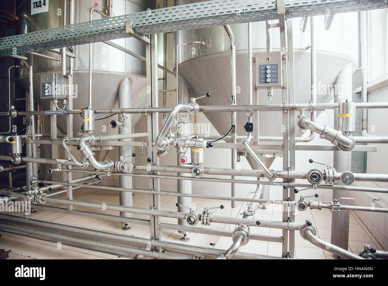 Modern beer plant, with brewing kettles, vessels, tubs and pipes made ...