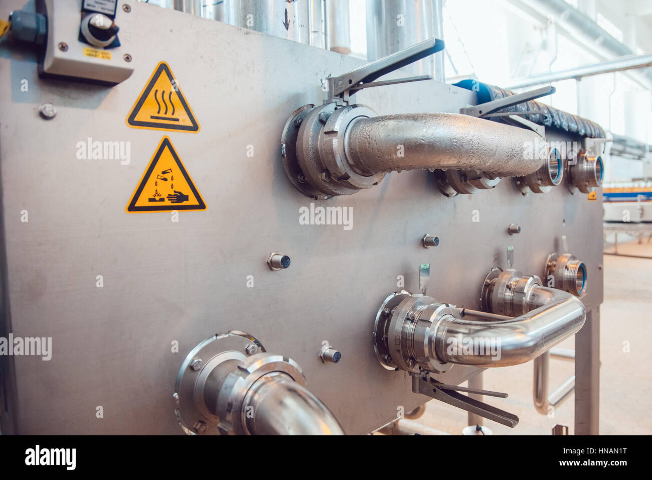 Modern beer plant, with brewing kettles, vessels, tubs and pipes made ...