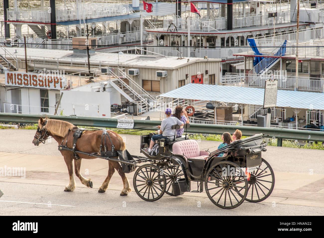Couples enjoying a horse drawn carriage ride through the streets of ...