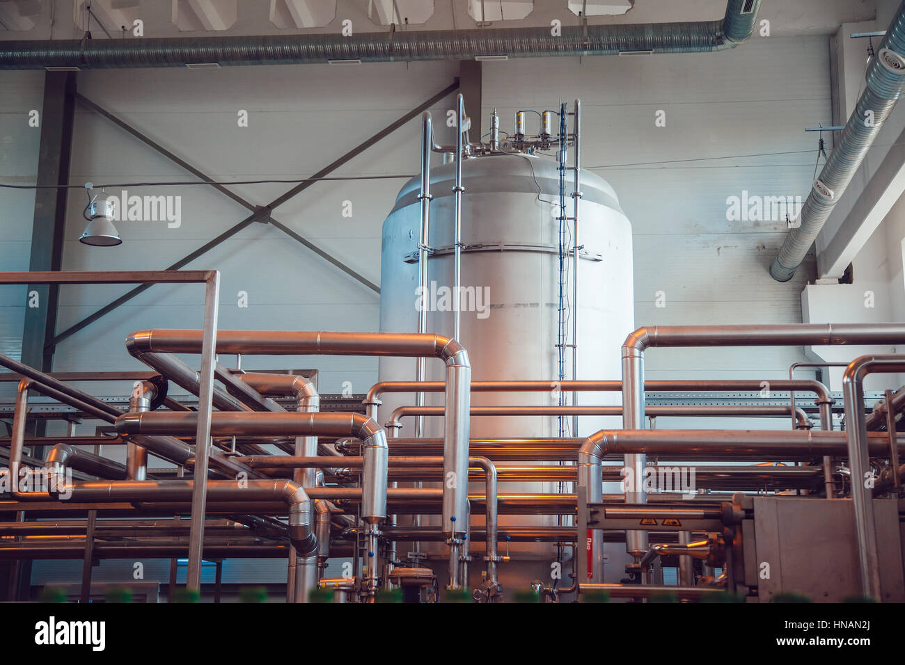 Modern beer plant, with brewing kettles, vessels, tubs and pipes made ...