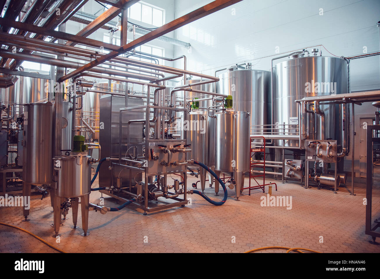 Modern beer plant, with brewing kettles, vessels, tubs and pipes made ...