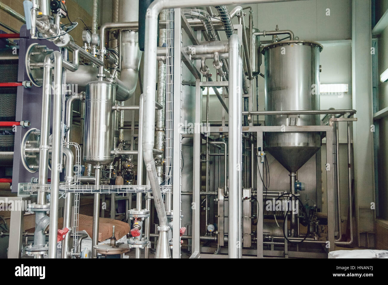 Modern beer plant, with brewing kettles, vessels, tubs and pipes made ...