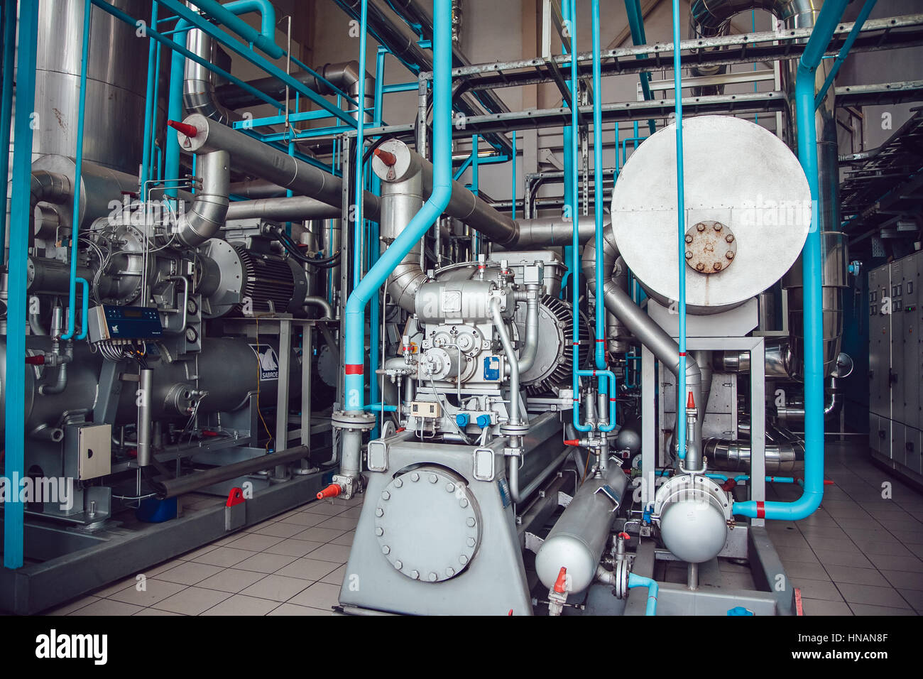 Modern beer plant, with brewing kettles, vessels, tubs and pipes made ...