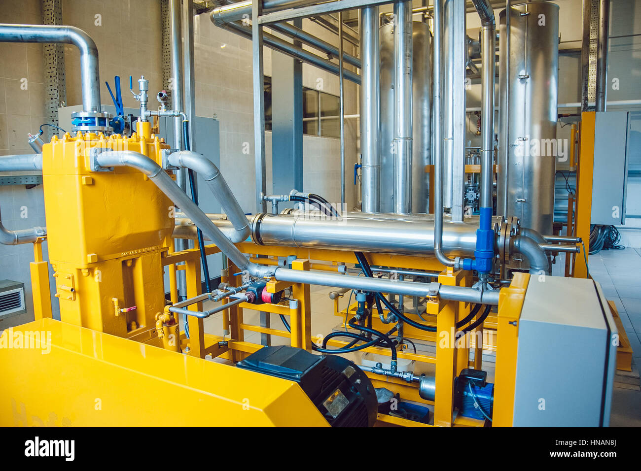 Modern beer plant, with brewing kettles, vessels, tubs and pipes made ...