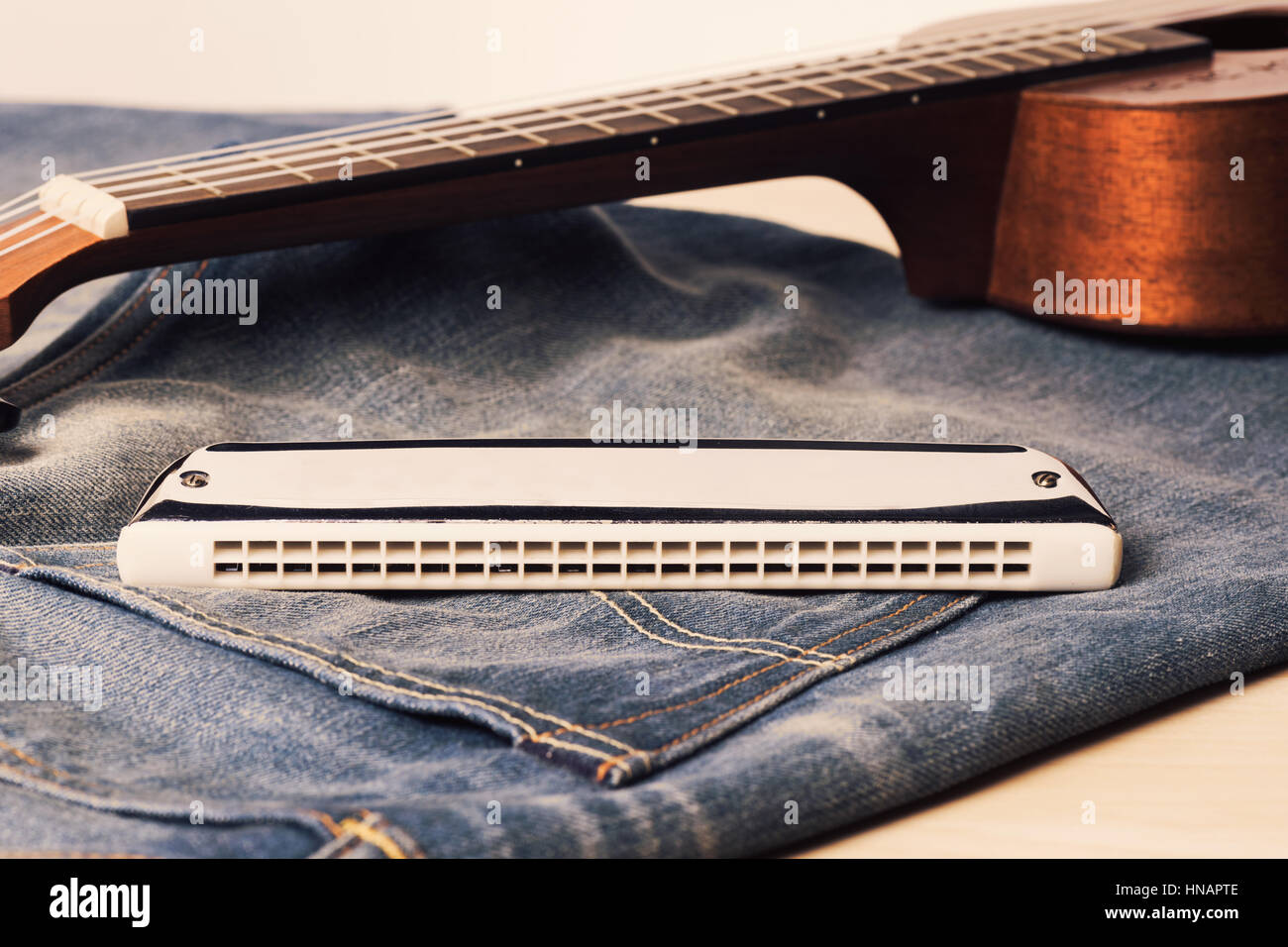 harmonica and ukulele, music instrument Stock Photo - Alamy