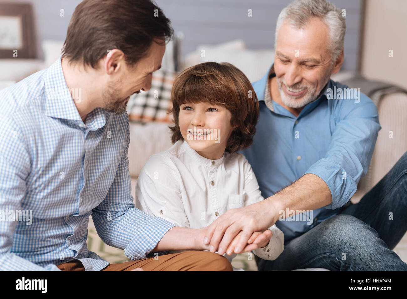 Joyful happy men holding their hands Stock Photo - Alamy