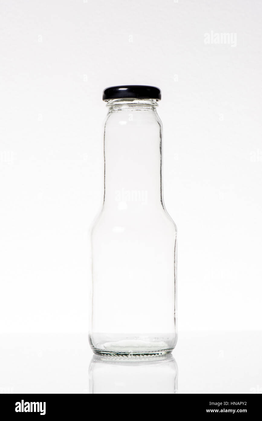 clear glass bottle isolated on white background Stock Photo - Alamy