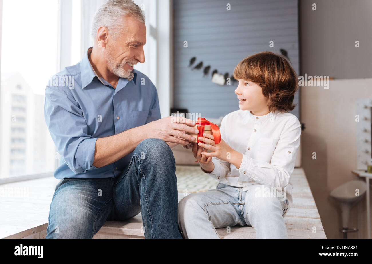Grandfather giving grandson hi-res stock photography and images - Alamy