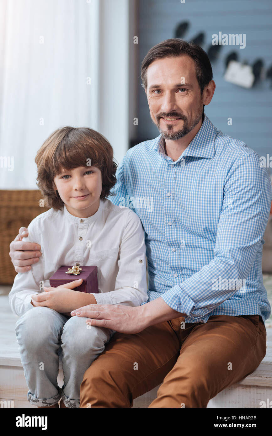 Boy holding a box hi-res stock photography and images - Alamy