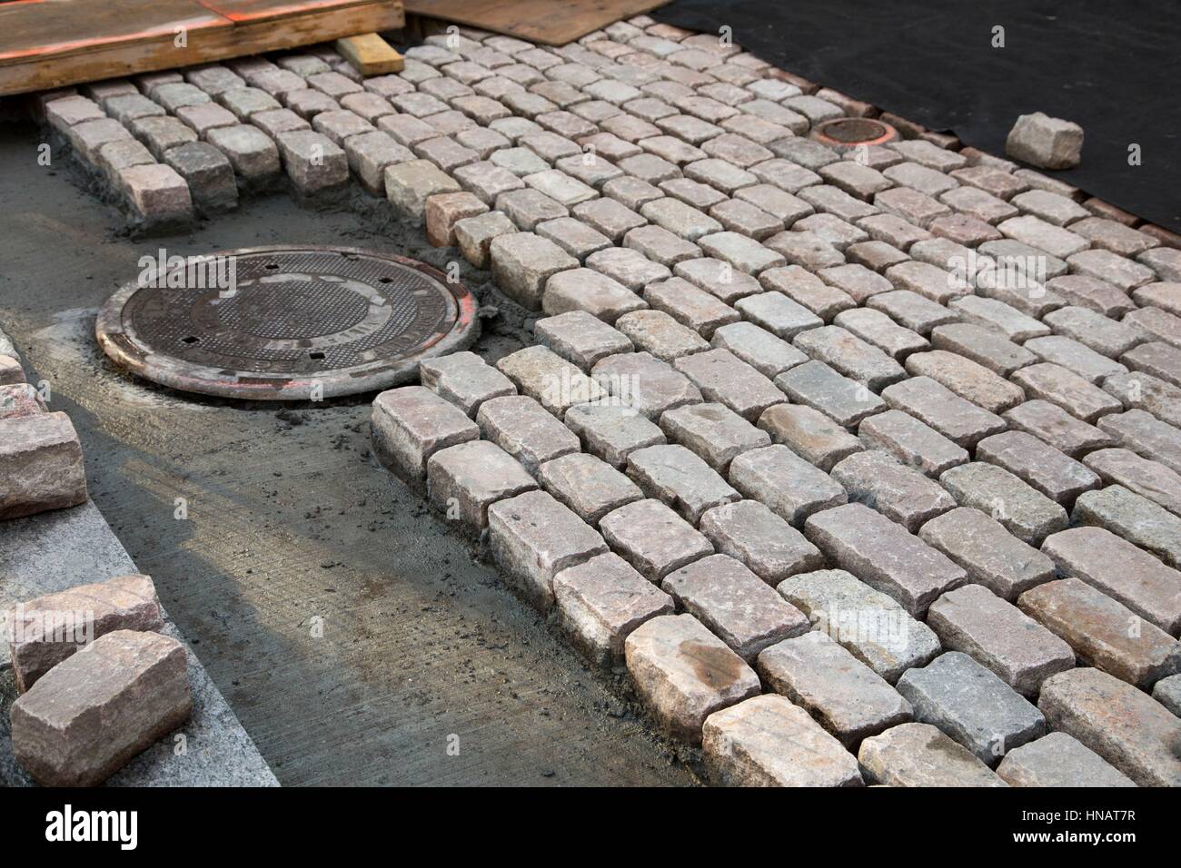 Laying belgian blocks hi-res stock photography and images - Alamy