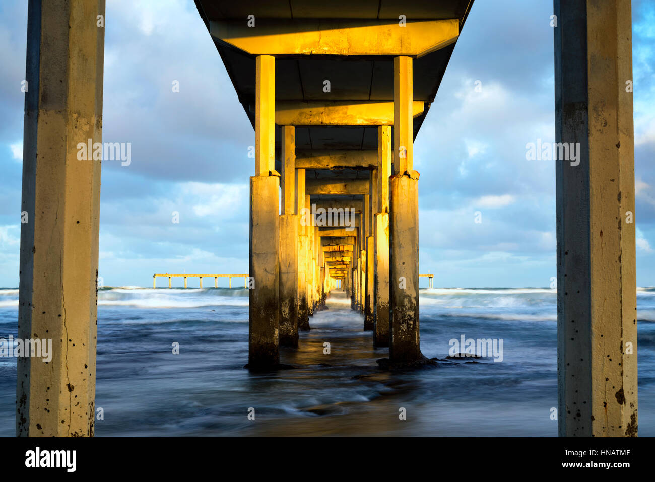 Ocean Beach Pier illuminated by the rising Sun. Ocean Beach, San Diego ...