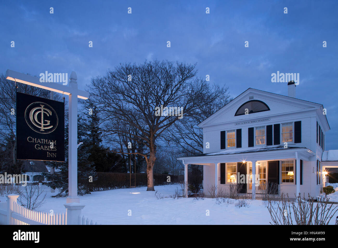 Twilight exterior of a luxury Cape Cod Inn during winter, Chatham ...