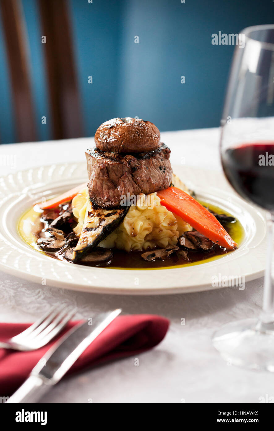 Filet mignon served on mashed potatoes with mixed vegetables, Bayfield ...