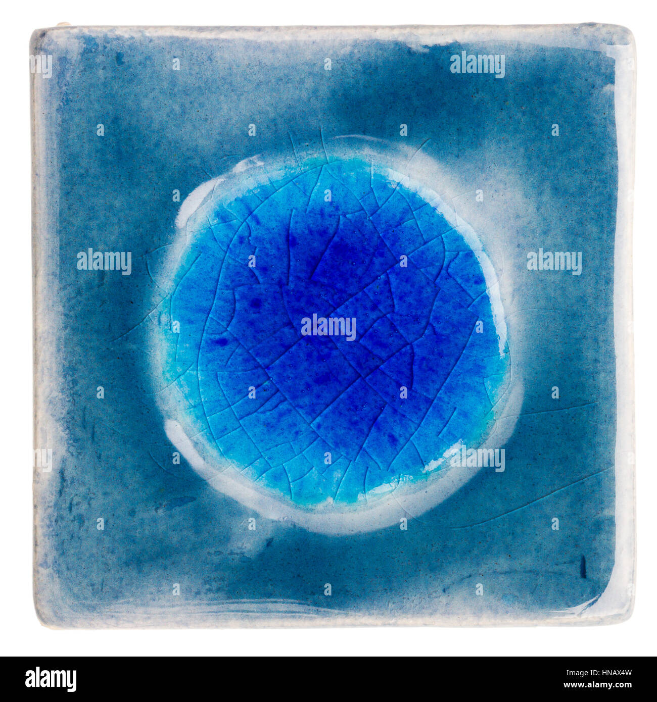 Blue handmade glazed ceramic tile with bubble in middle isolated on ...