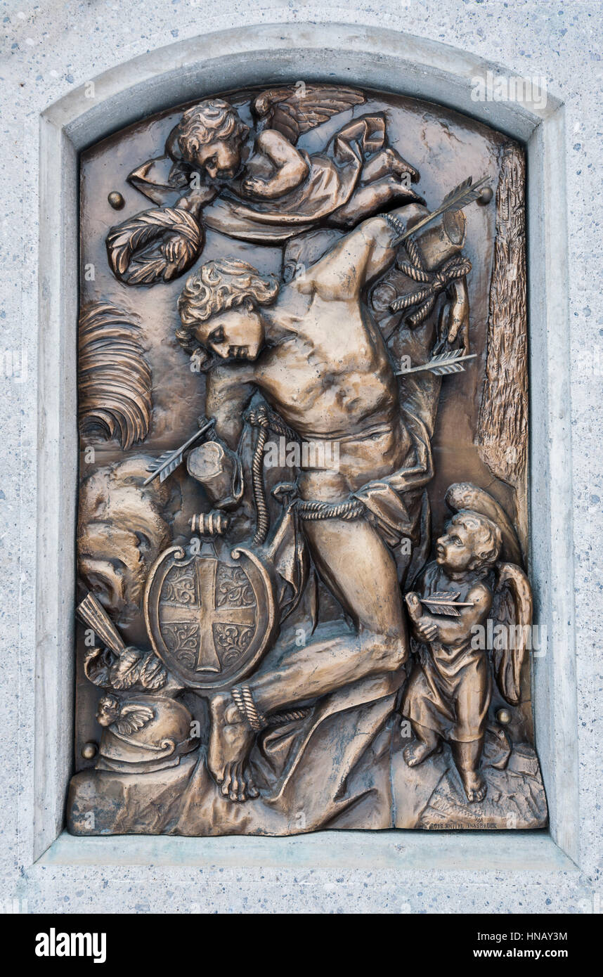 Bronze relief of San Sebastian pierced by arrows Stock Photo - Alamy