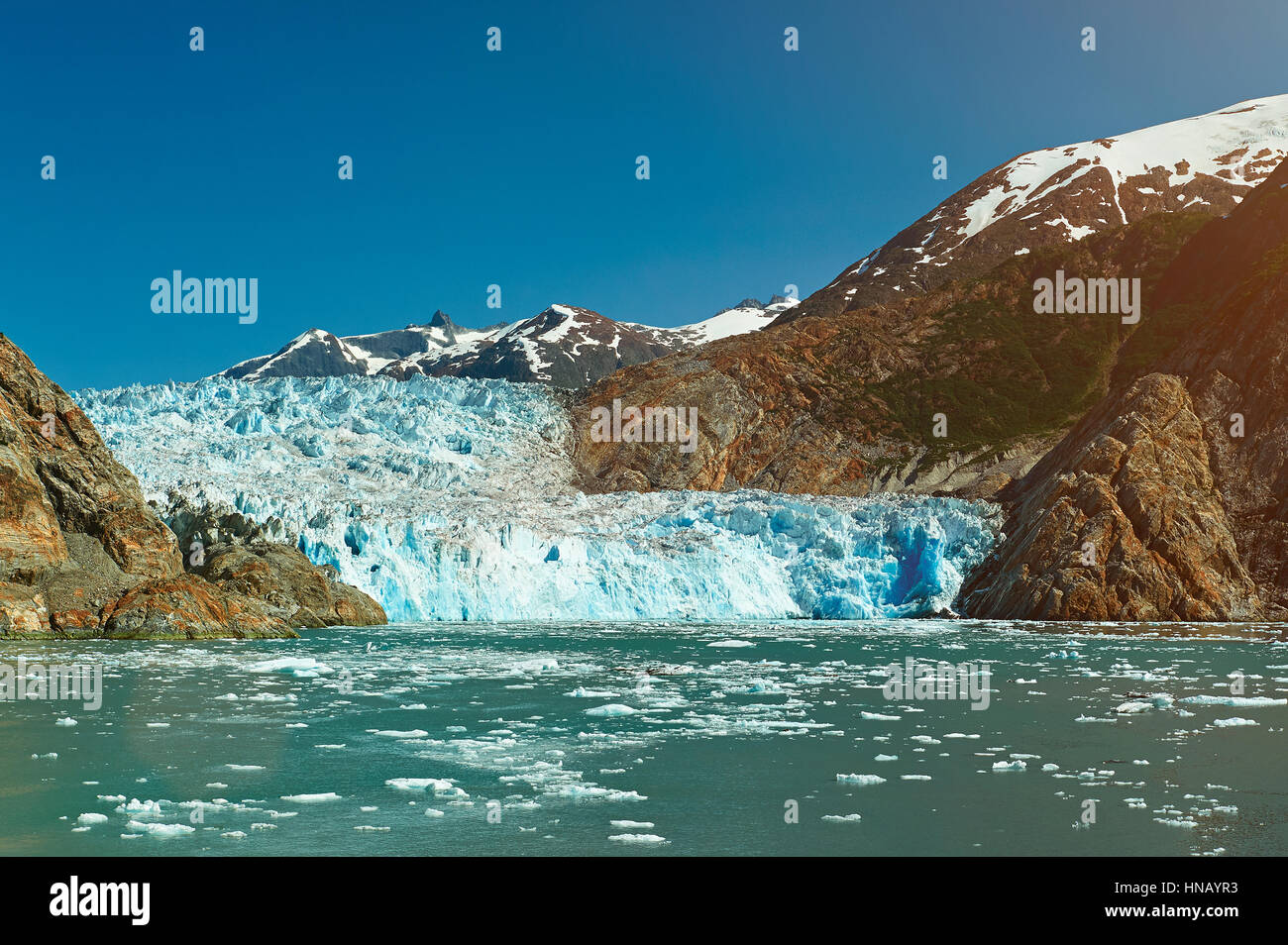 glacier ice melt next to green sea water Stock Photo - Alamy