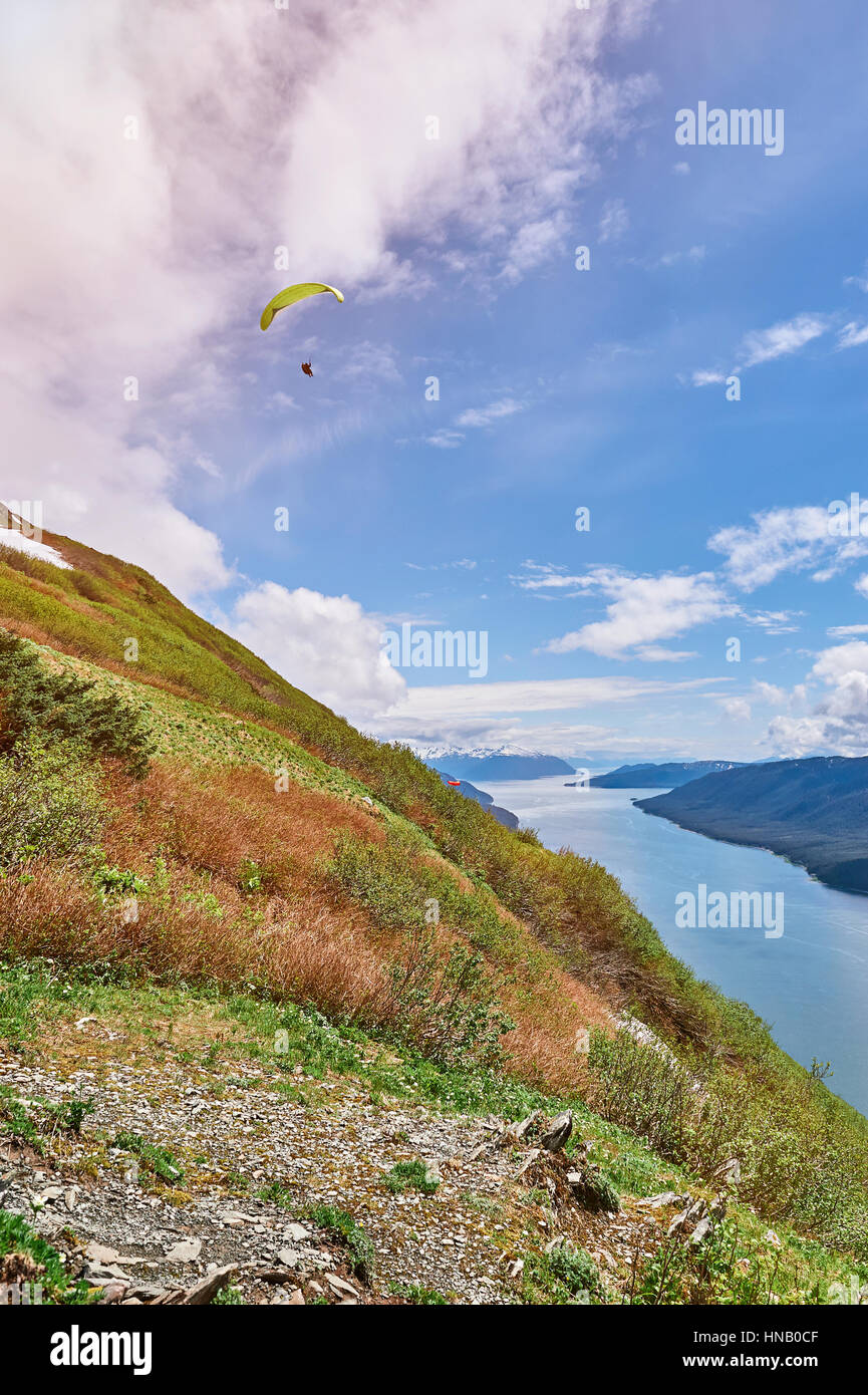 paraplane in alaska landscape with sun light sky Stock Photo - Alamy