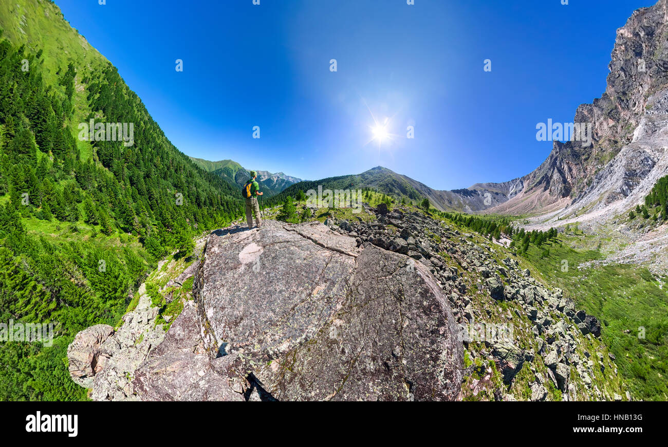 Wide aerial panorama man with backpack standing in mountains Stock ...
