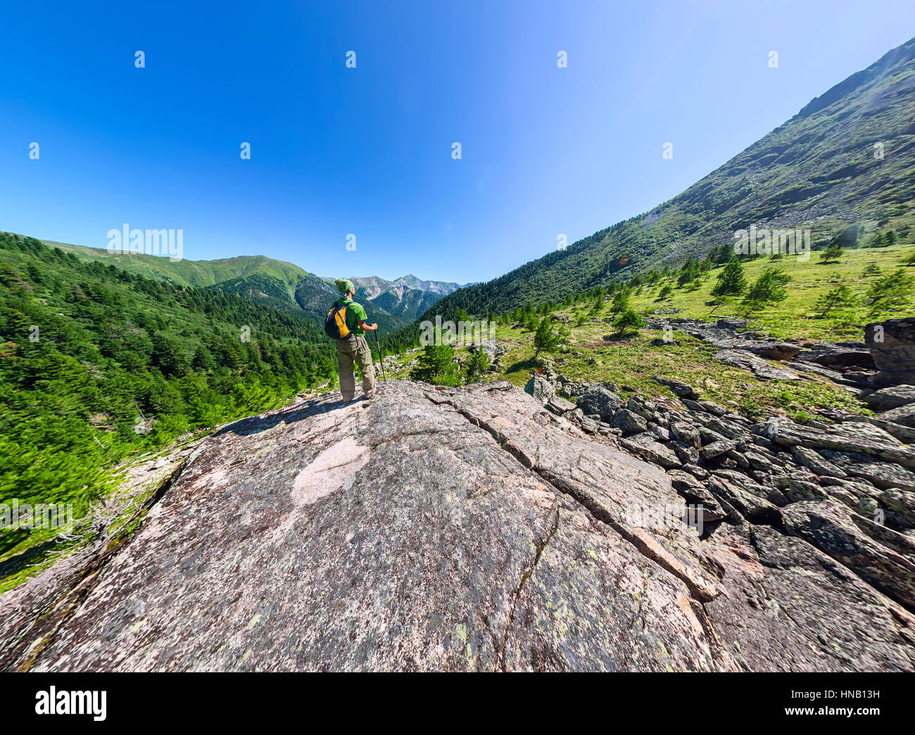 Wide aerial panorama man with backpack standing in mountains Stock ...