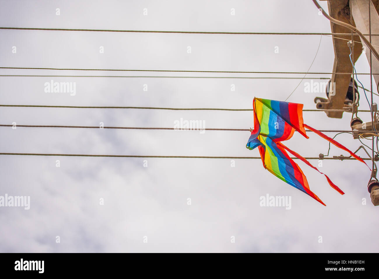 A kite stuck on a power line Stock Photo - Alamy