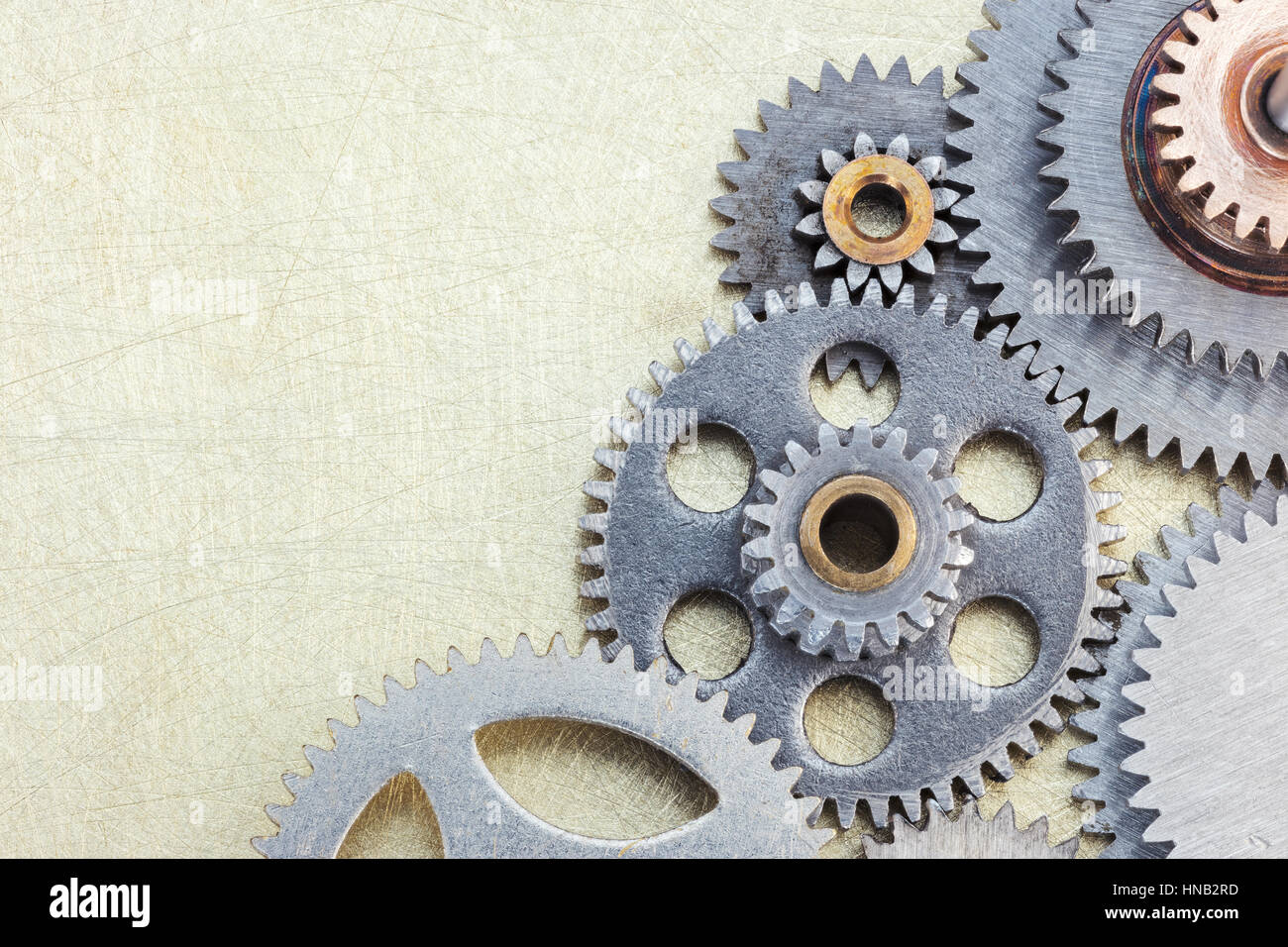 steel gears as details of machines on brass metal background Stock ...