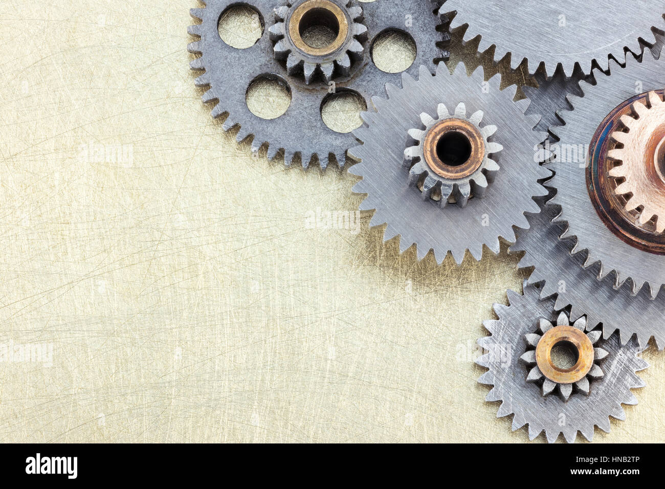 metal gear cogwheels on industrial scratched background, top view Stock ...