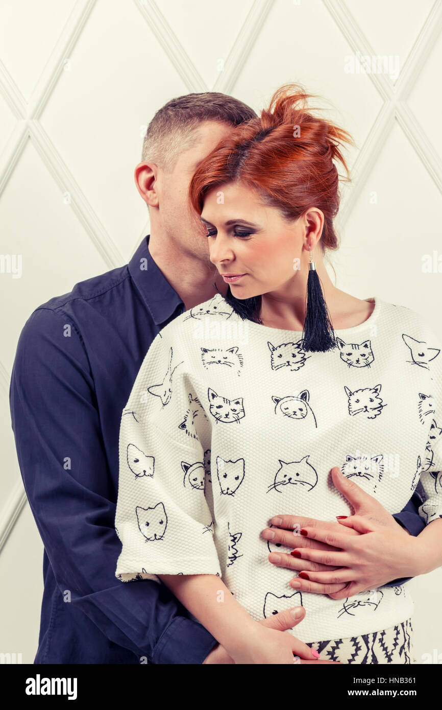 Beautiful loving couple in elegant clothes. Studio photo Stock Photo ...