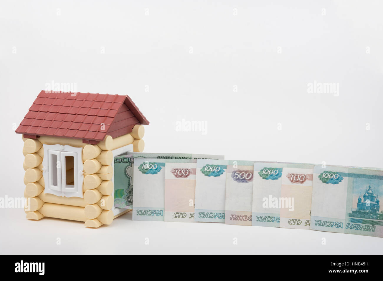 Before the doors open toy house lined up Russian rubles banknotes of ...