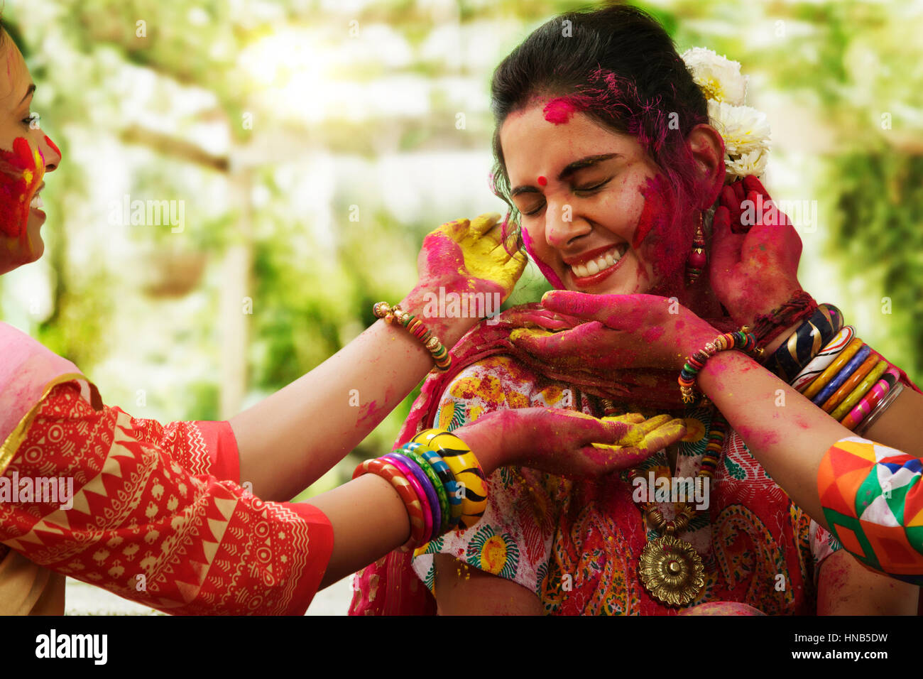 Indian girls celebrating Holi festival with traditional dresses and ...