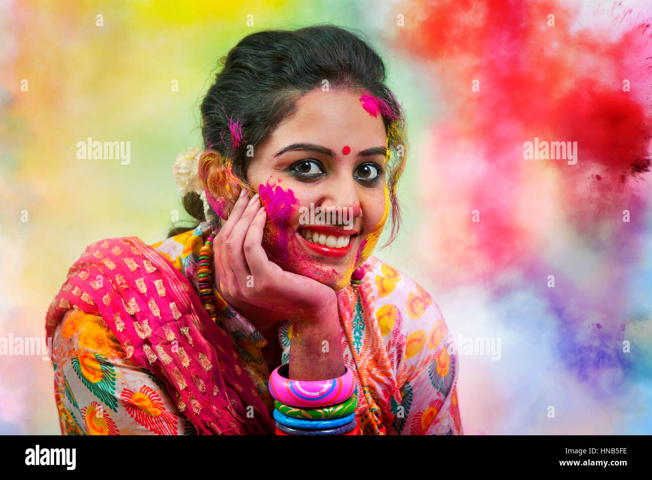 Portrait of young Indian Woman celebrating Holi color festival Stock ...