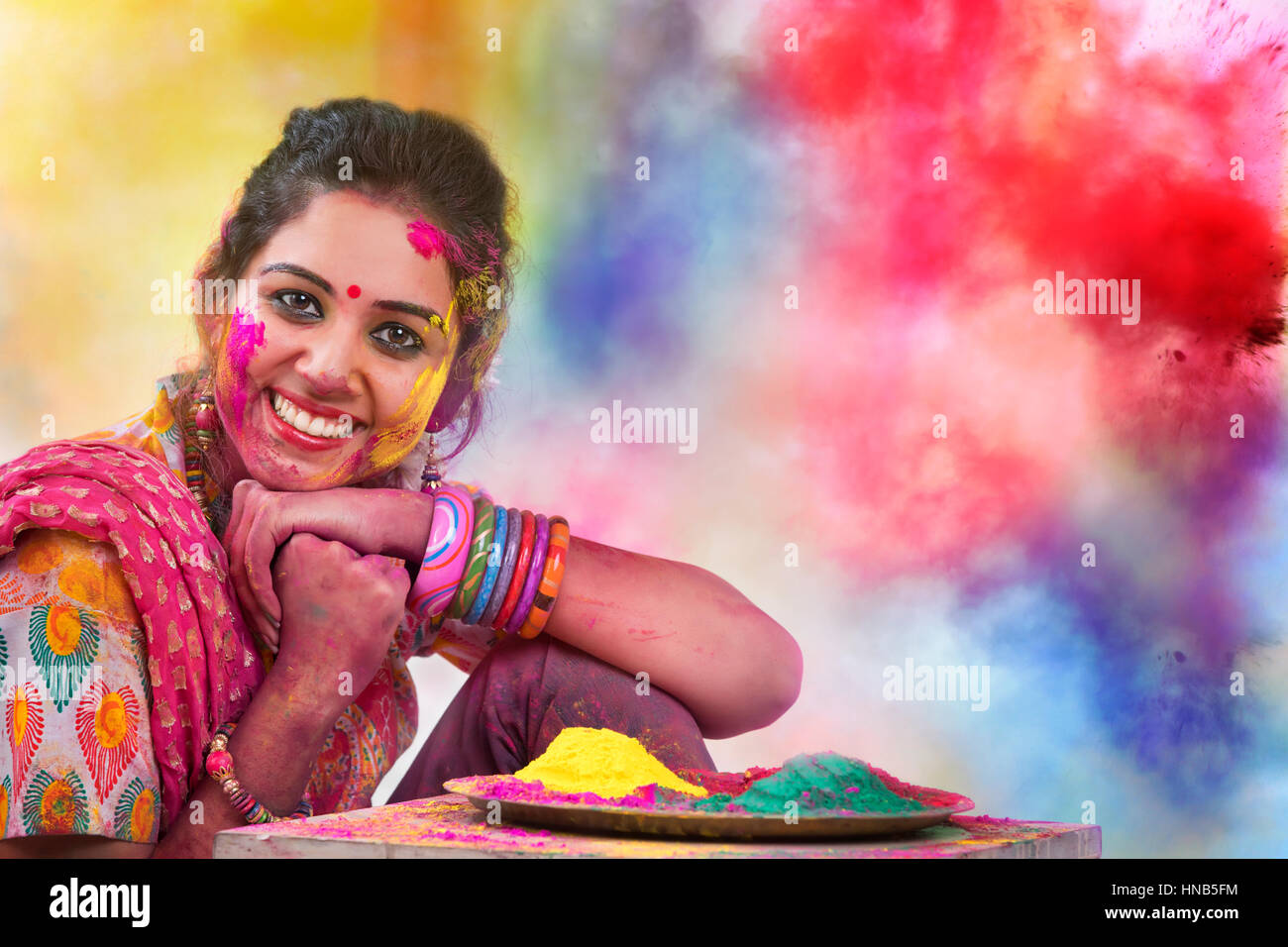 Portrait of young Indian Woman celebrating Holi color festival Stock ...