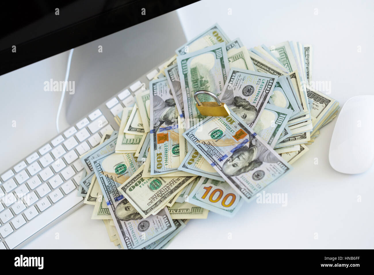 Security lock on dollar bills with white computer keyboard - breach of ...