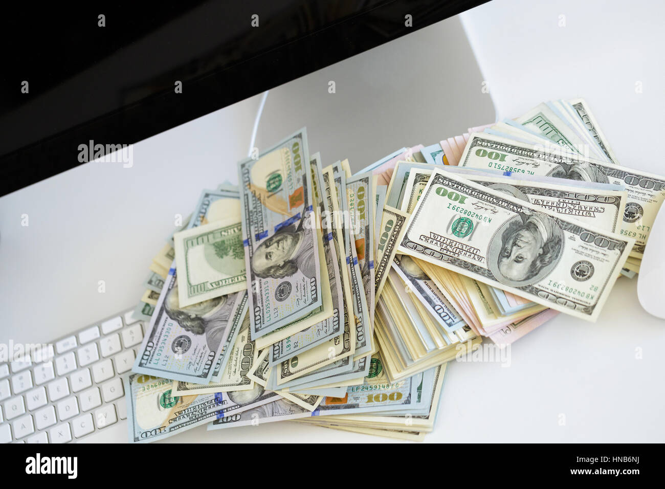 Dollar bills on the white computer keyboard - online payments concept ...