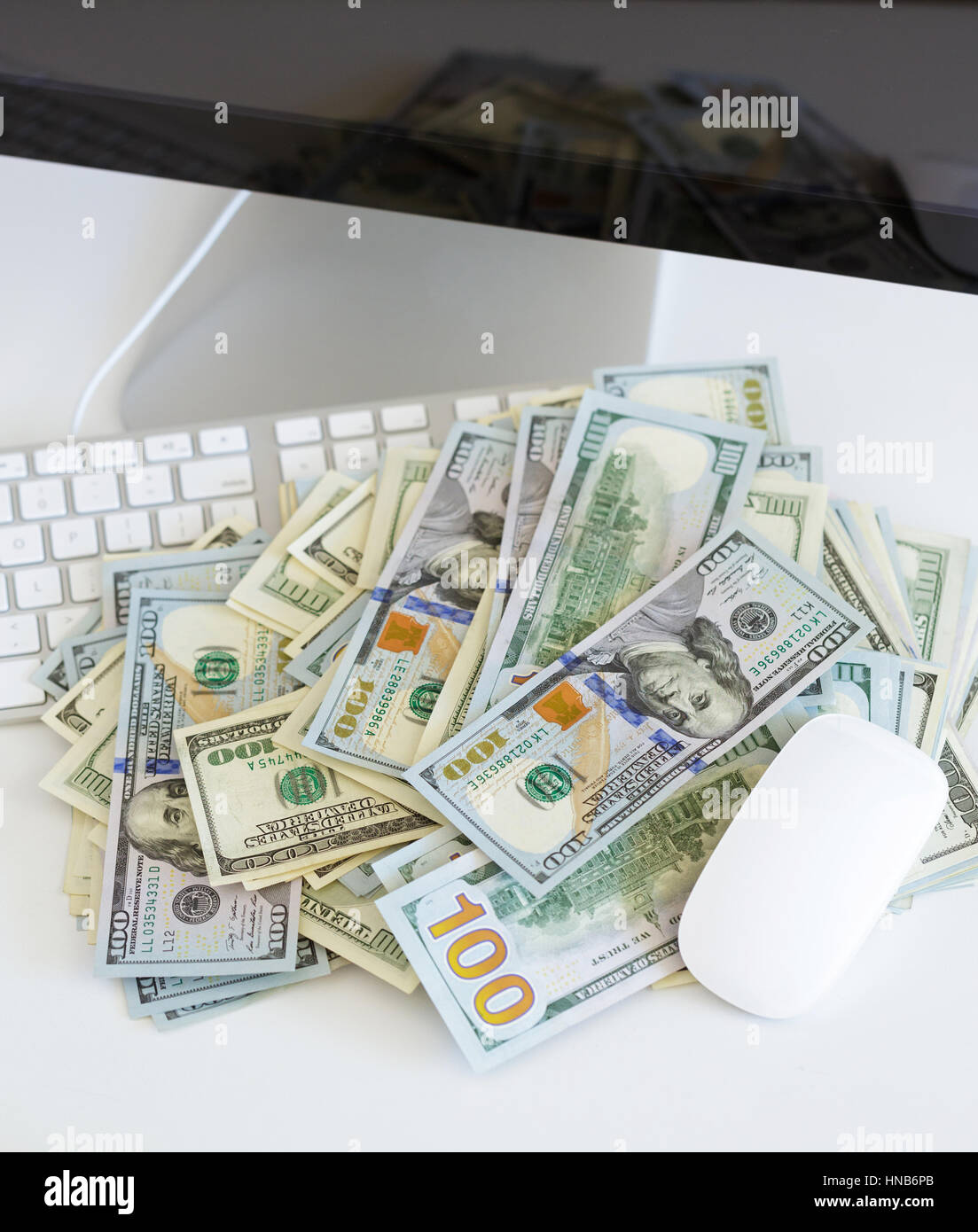 Dollar bills on the white computer keyboard - online payments concept ...