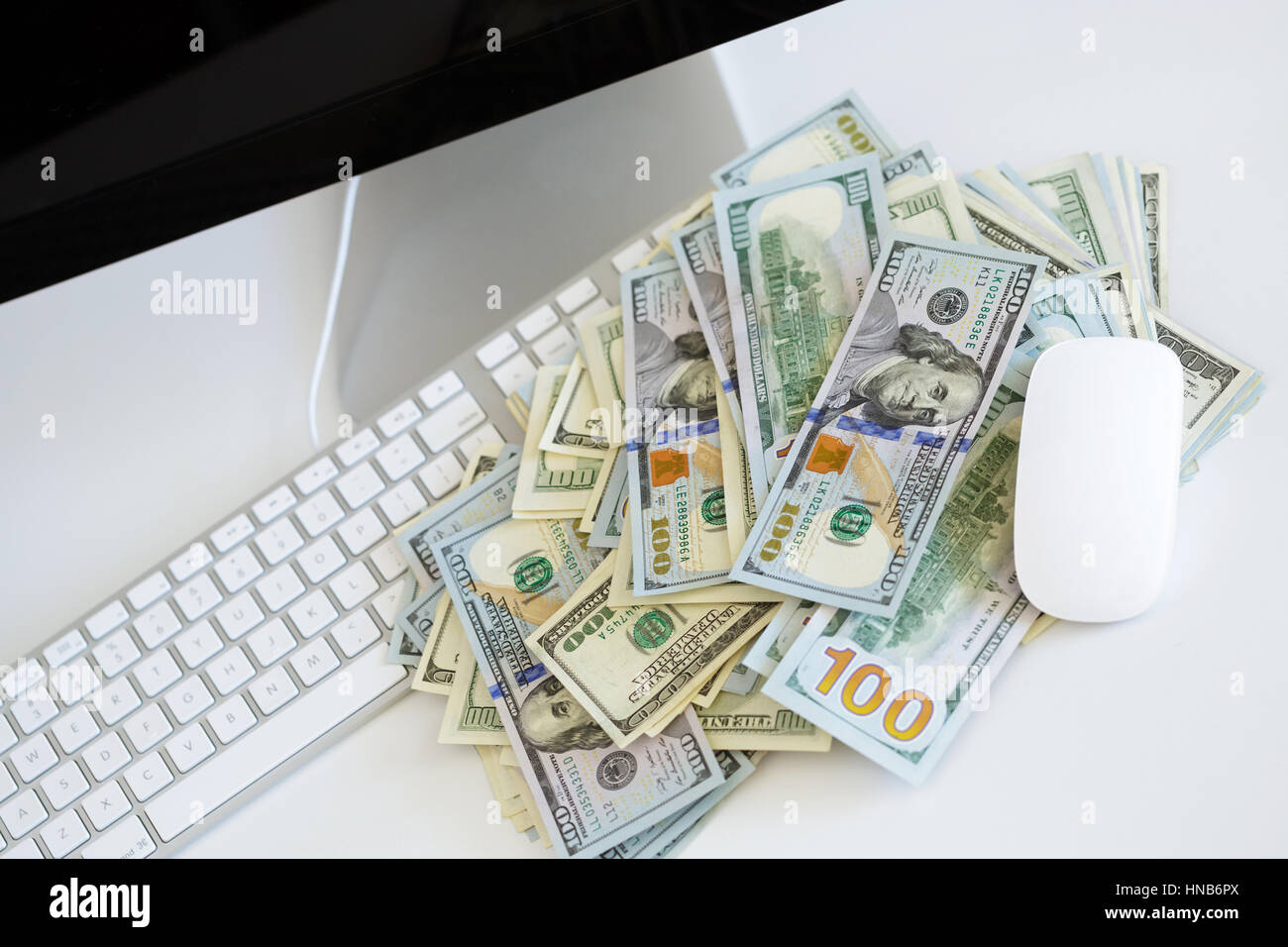 Dollar bills on the white computer keyboard - online payments concept ...