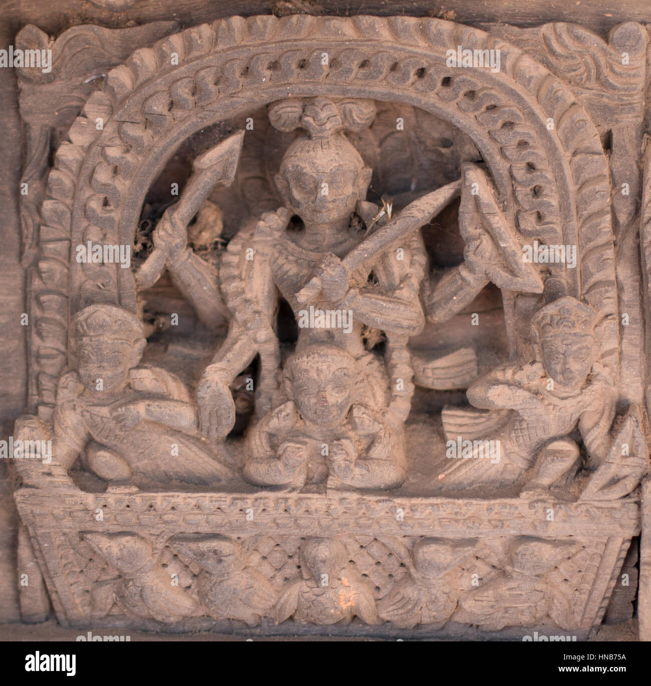 Wood carving of Hindu deities and heavenly nymphs adorn the walls of a ...