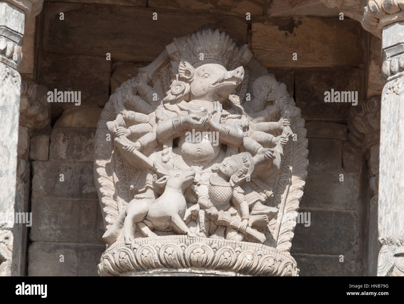 Stone carvings of Hindu gods and nymphs on the outside of a temple in ...