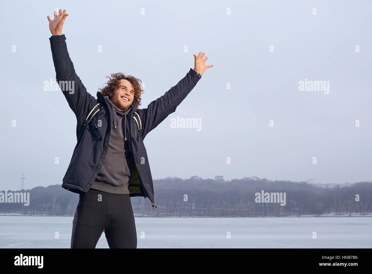 The concept of happiness, travel, adventure. Happy young man rai Stock ...