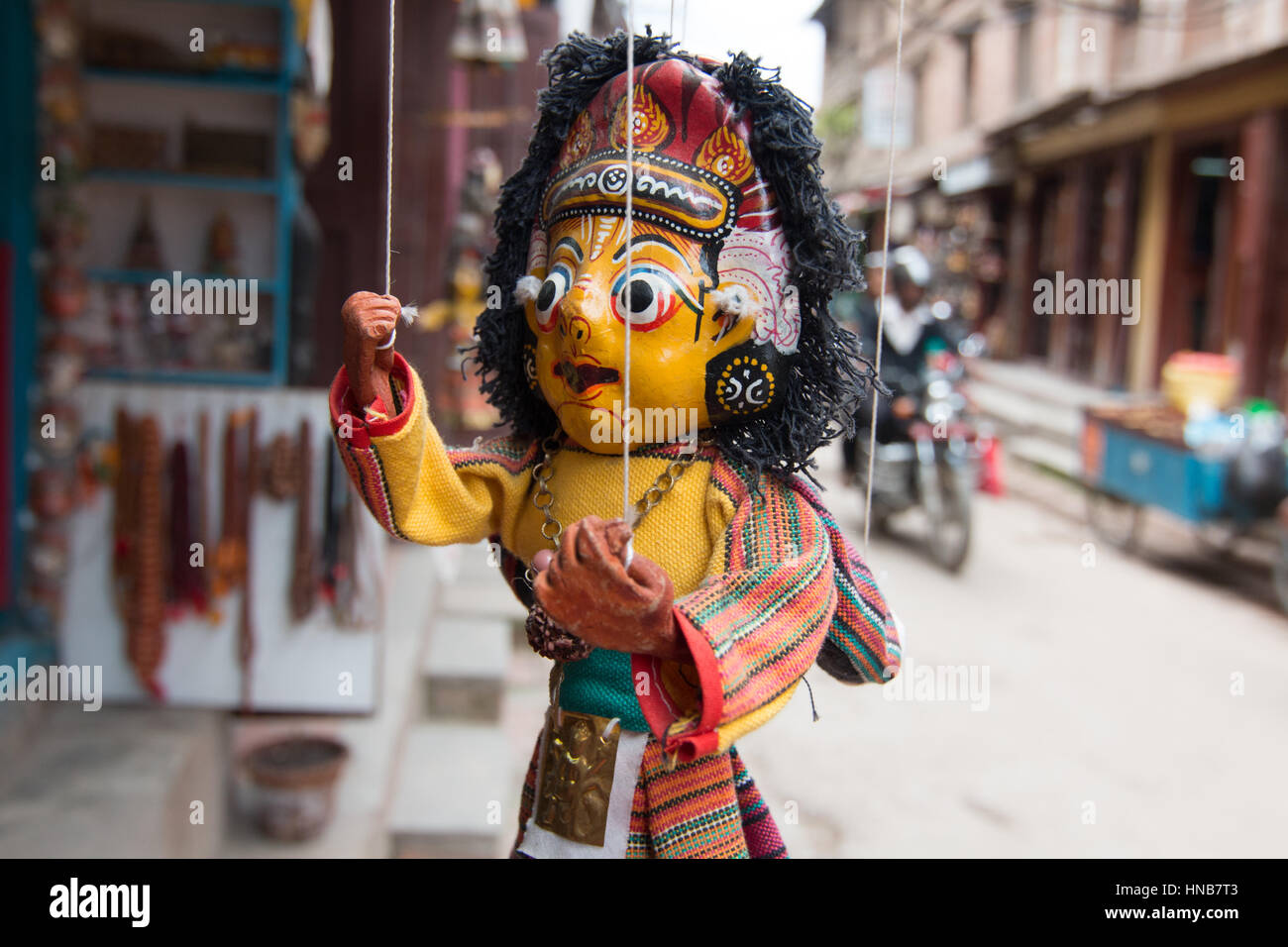Traditional colourful wooden Nepalese puppet of a mythological creature ...