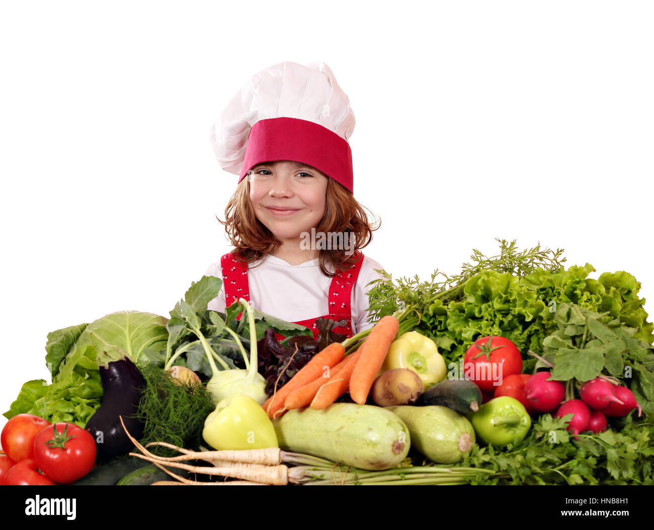 beautiful little girl cook with vegetables Stock Photo - Alamy