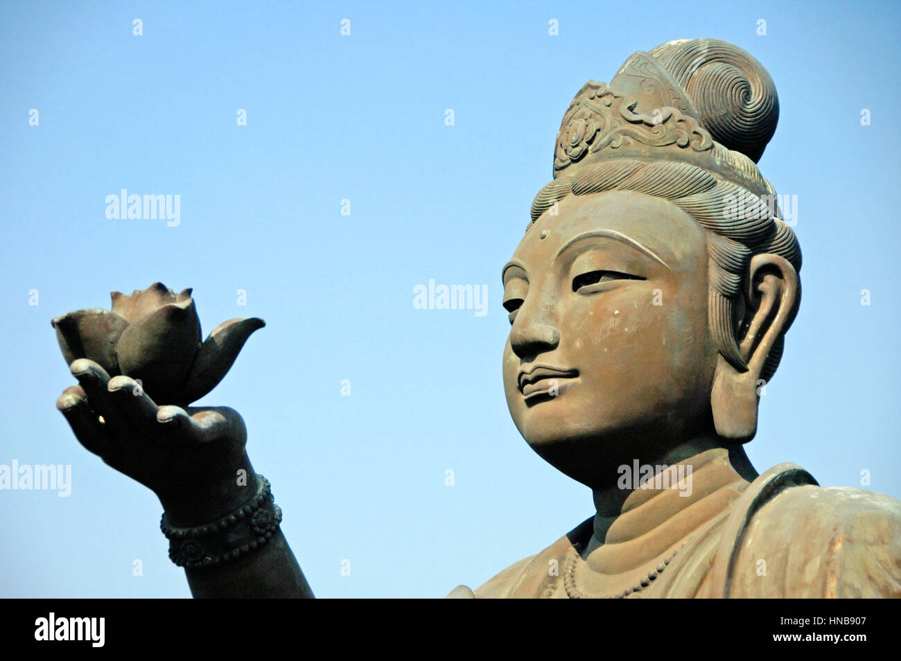goddess offering lotus flower and gifts to Buddha Stock Photo - Alamy
