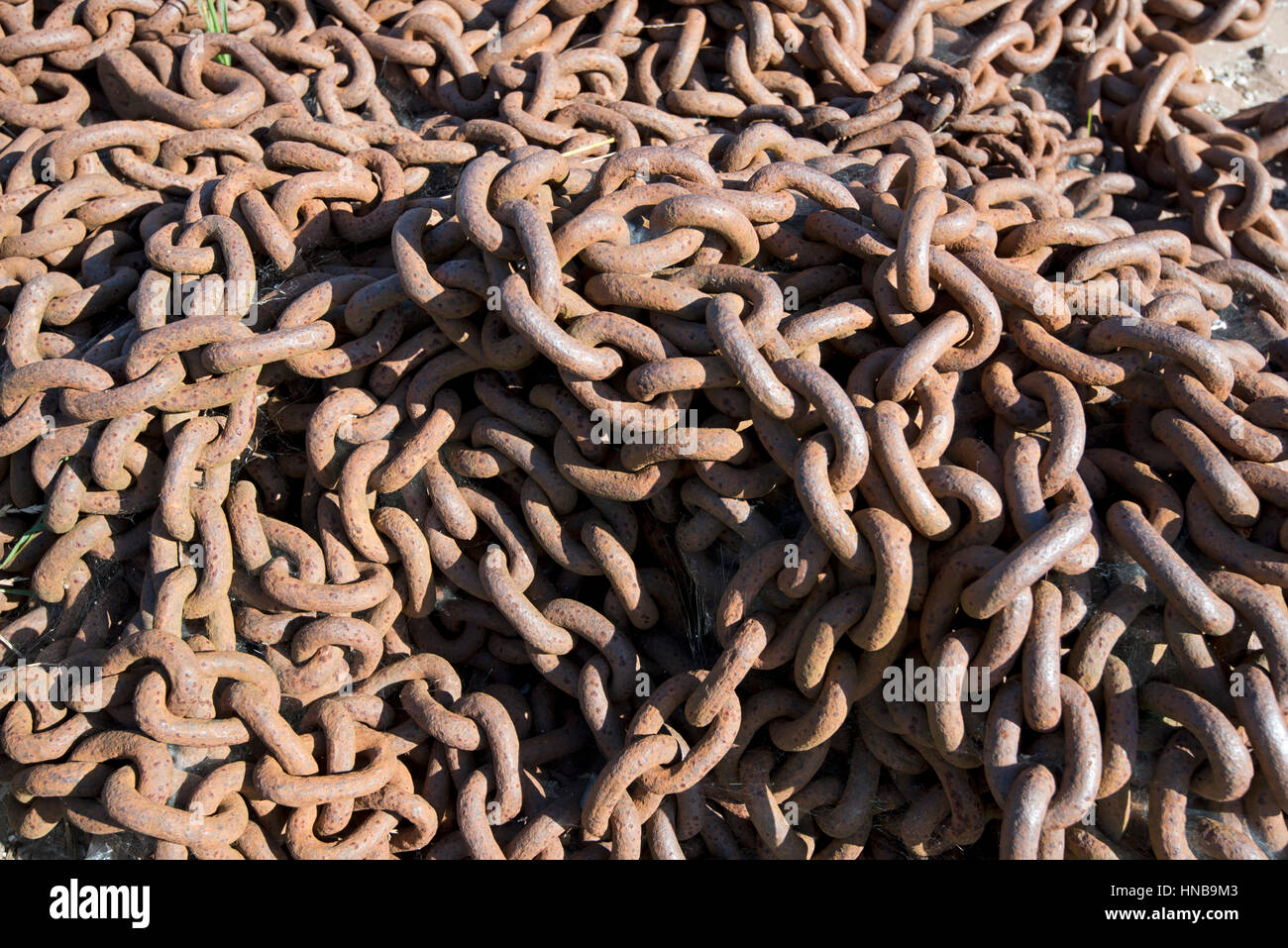 Rusty iron chain to make a connection Stock Photo - Alamy