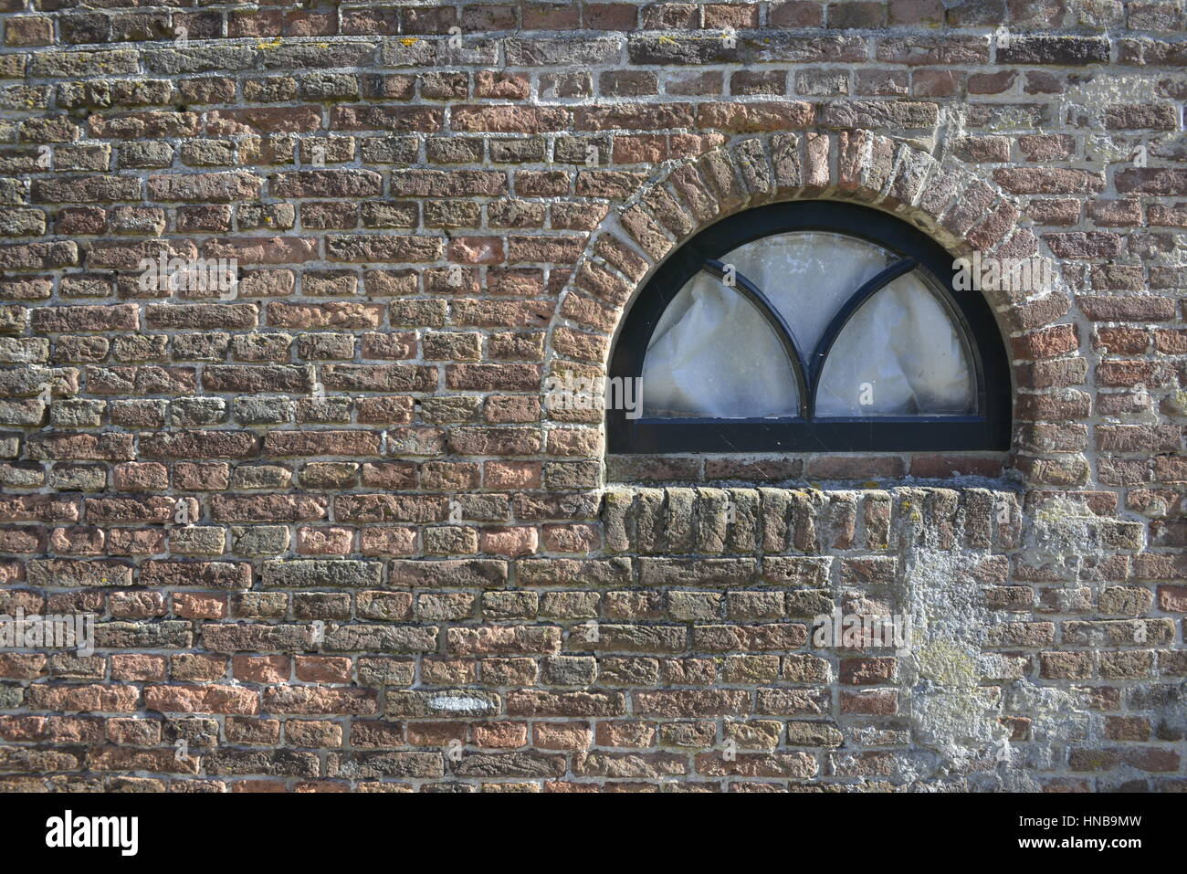 a stone wall with window Stock Photo - Alamy