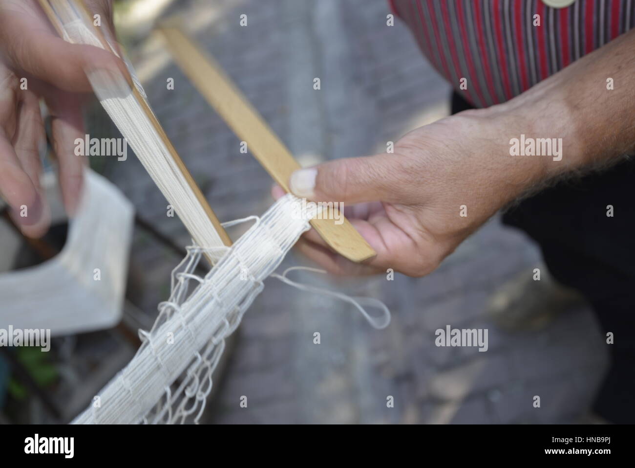 Fixing a fish net hi-res stock photography and images - Alamy